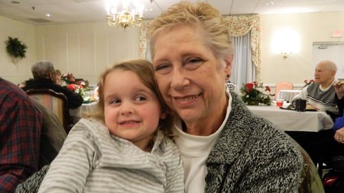 Residents host friends and family for a holiday party - Homeland Center